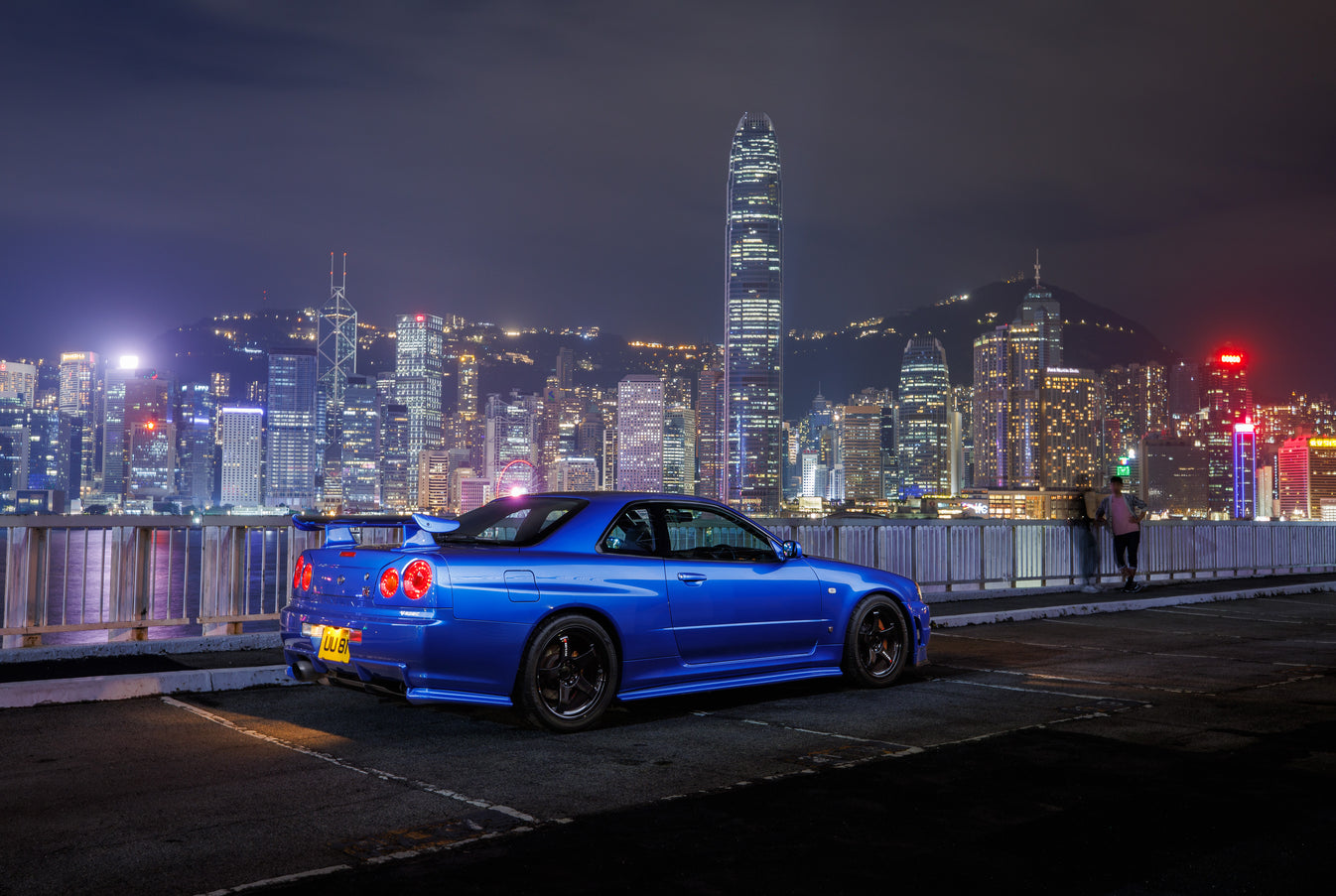 Nissan Skyline R34 GT-R in Hong Kong with Victoria Harbor in the backg ...